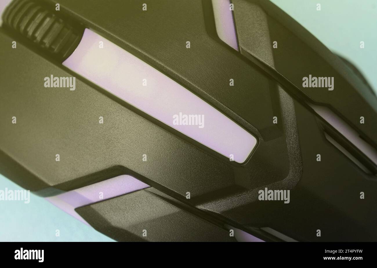 Closeup of a black gaming optical mouse on a blue background. Device ...