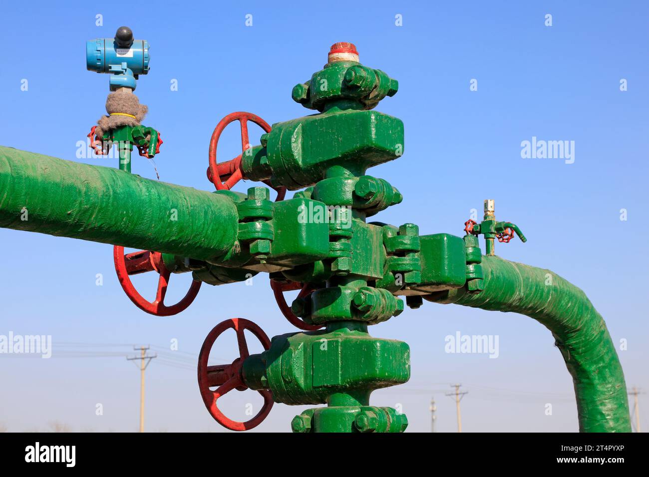 Oil pipeline control handwheel under the blue sky, closeup of photo ...