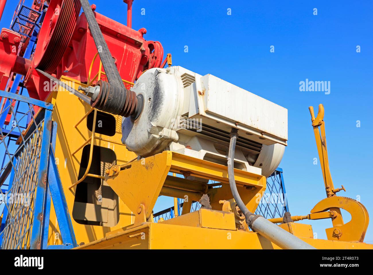motor on pumping unit under blue sky in oilfield Stock Photo - Alamy
