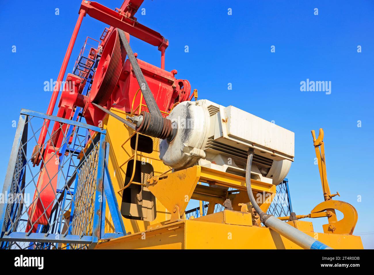 motor on pumping unit under blue sky in oilfield Stock Photo - Alamy