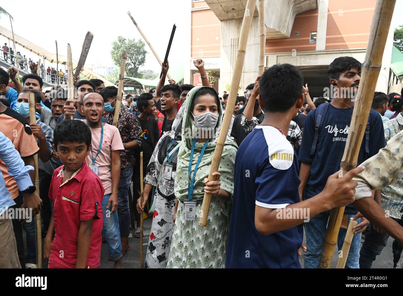 Garment workers block roads as they take part in a protest demanding an ...