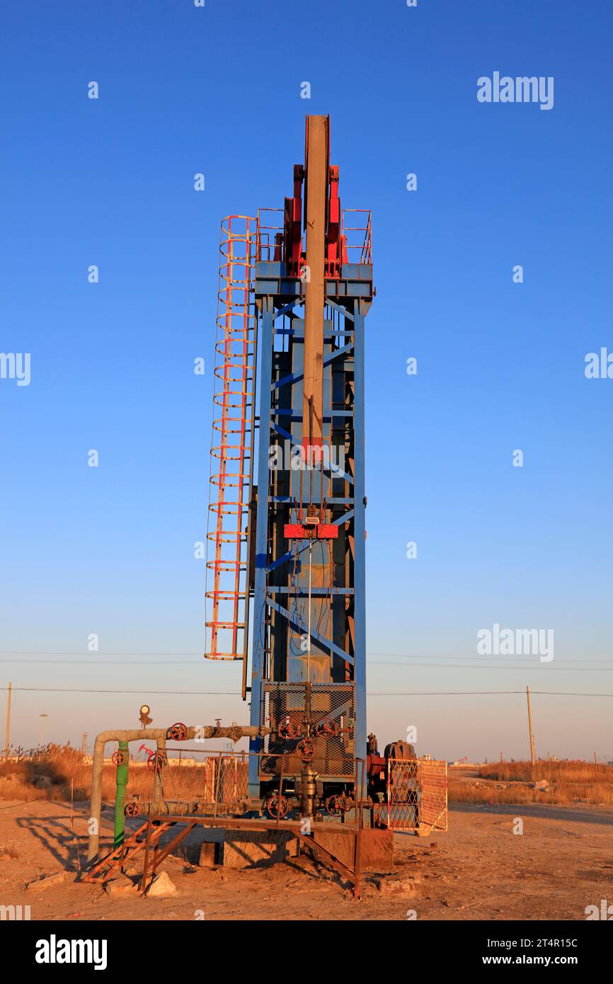 tower type pumping unit under blue sky in oilfield Stock Photo - Alamy