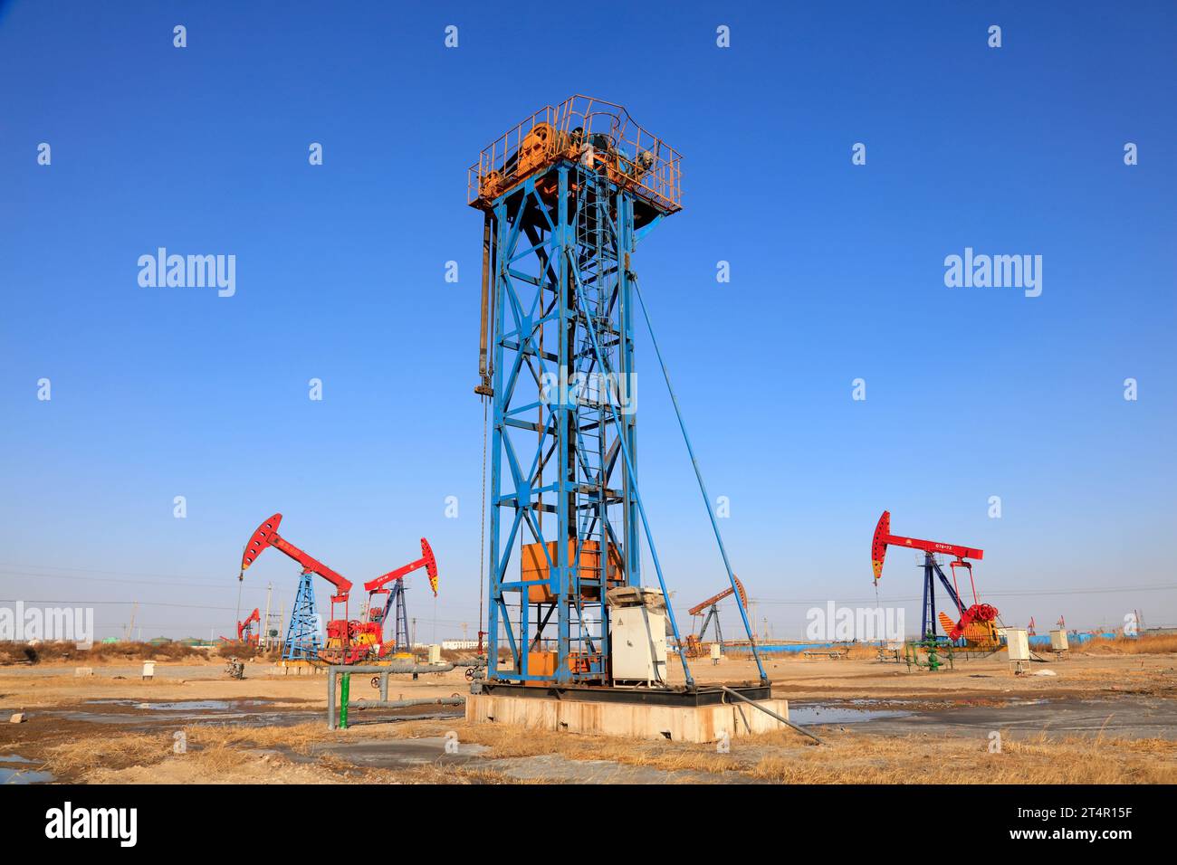 tower type pumping unit under blue sky in oilfield Stock Photo - Alamy