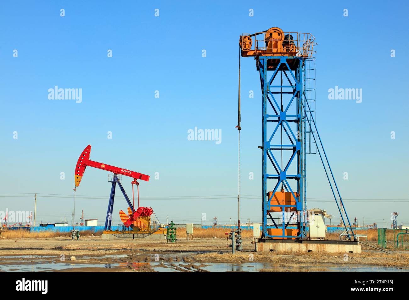 tower type pumping unit under blue sky in oilfield Stock Photo - Alamy