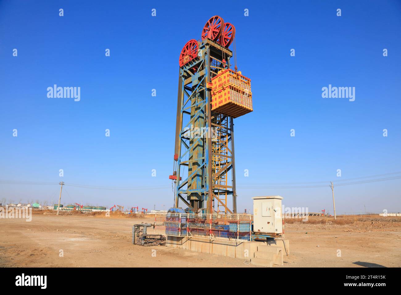 tower type pumping unit under blue sky in oilfield Stock Photo - Alamy