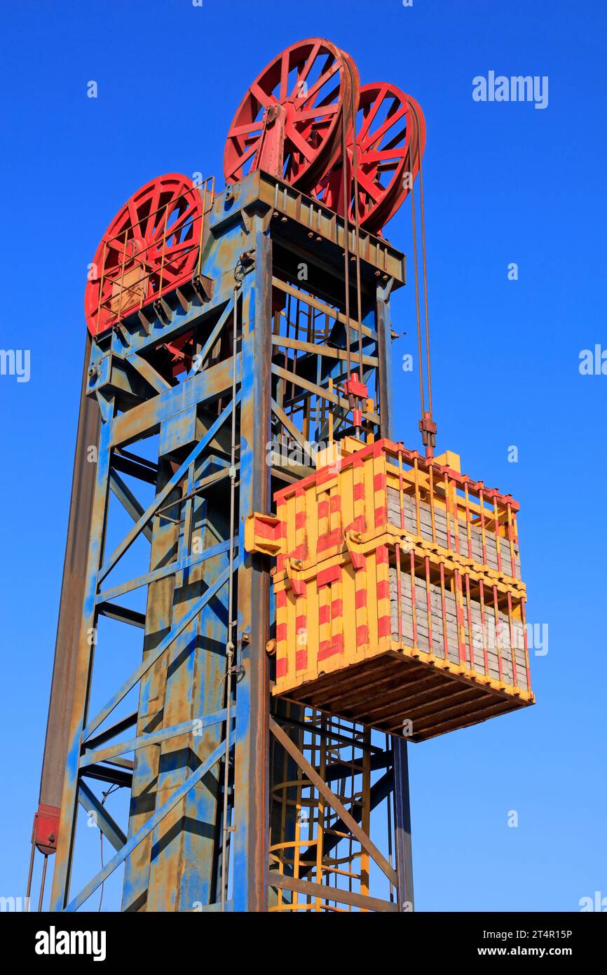 tower type pumping unit under blue sky in oilfield Stock Photo - Alamy