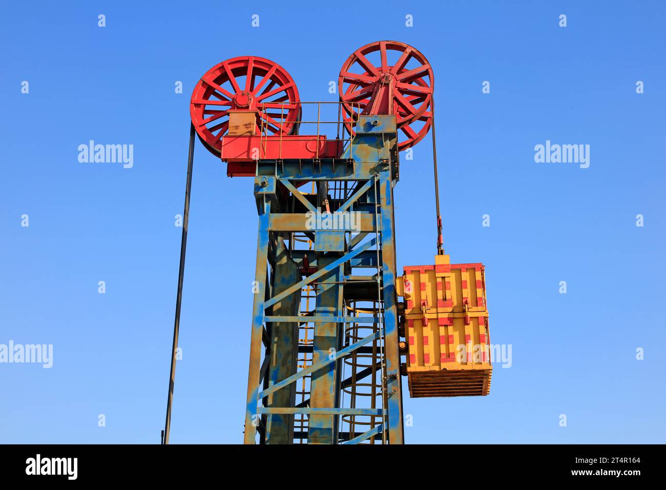 tower type pumping unit under blue sky in oilfield Stock Photo - Alamy