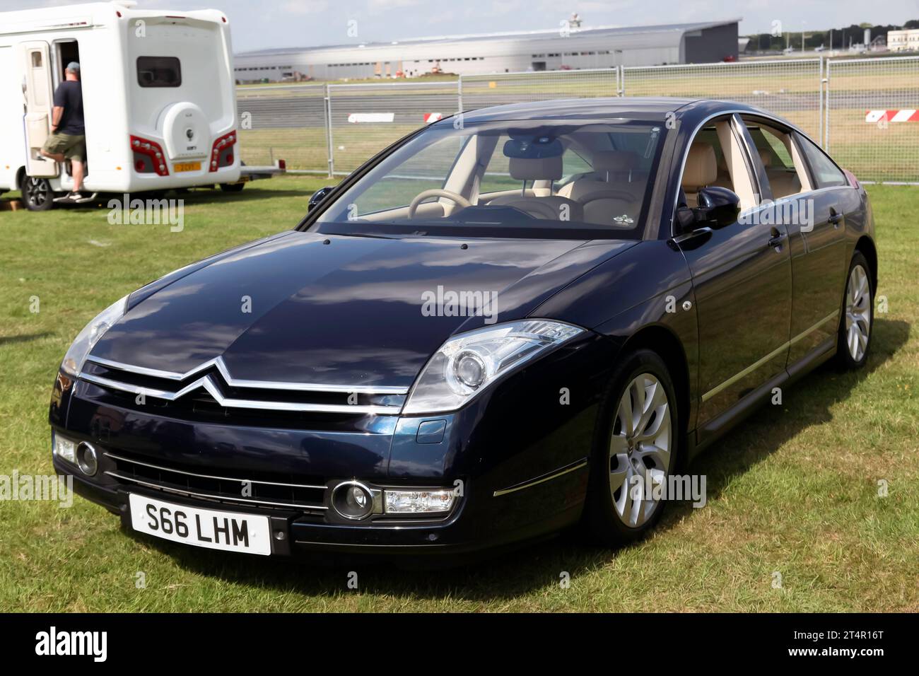 Three-quarter front view of a Dark Blue, 2010, Citroën C6, on display ...