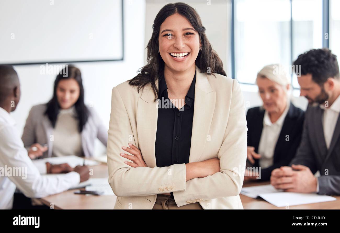 Our meetings always go well. a young businesswoman standing with her ...