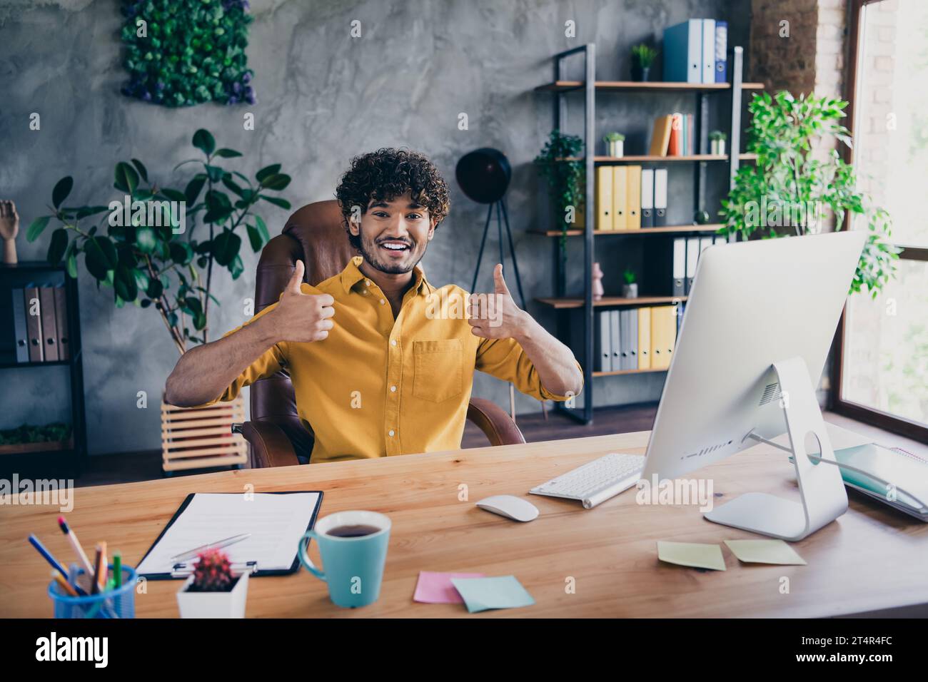 Photo of positive funny man it specialist hacker demonstrate thumbs up ...
