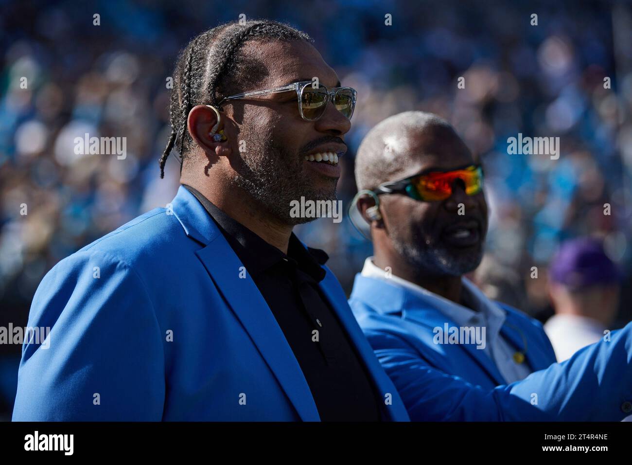 Former Carolina Panthers greats Julius Peppers (left) and Muhsin ...