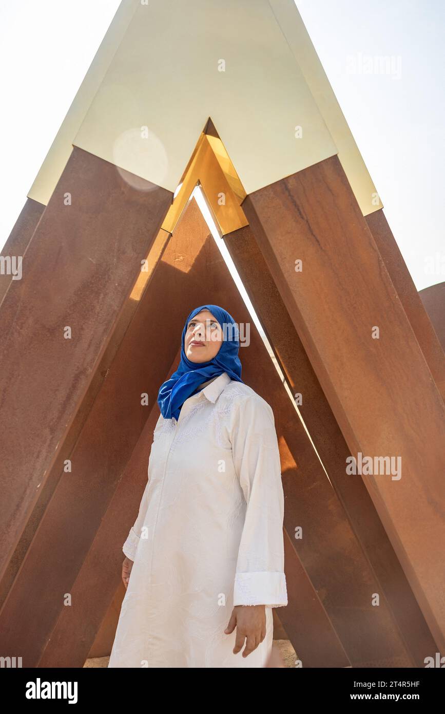 Emirati artist Azza al Qubaisi poses next to her artwork ‘Treasures ...