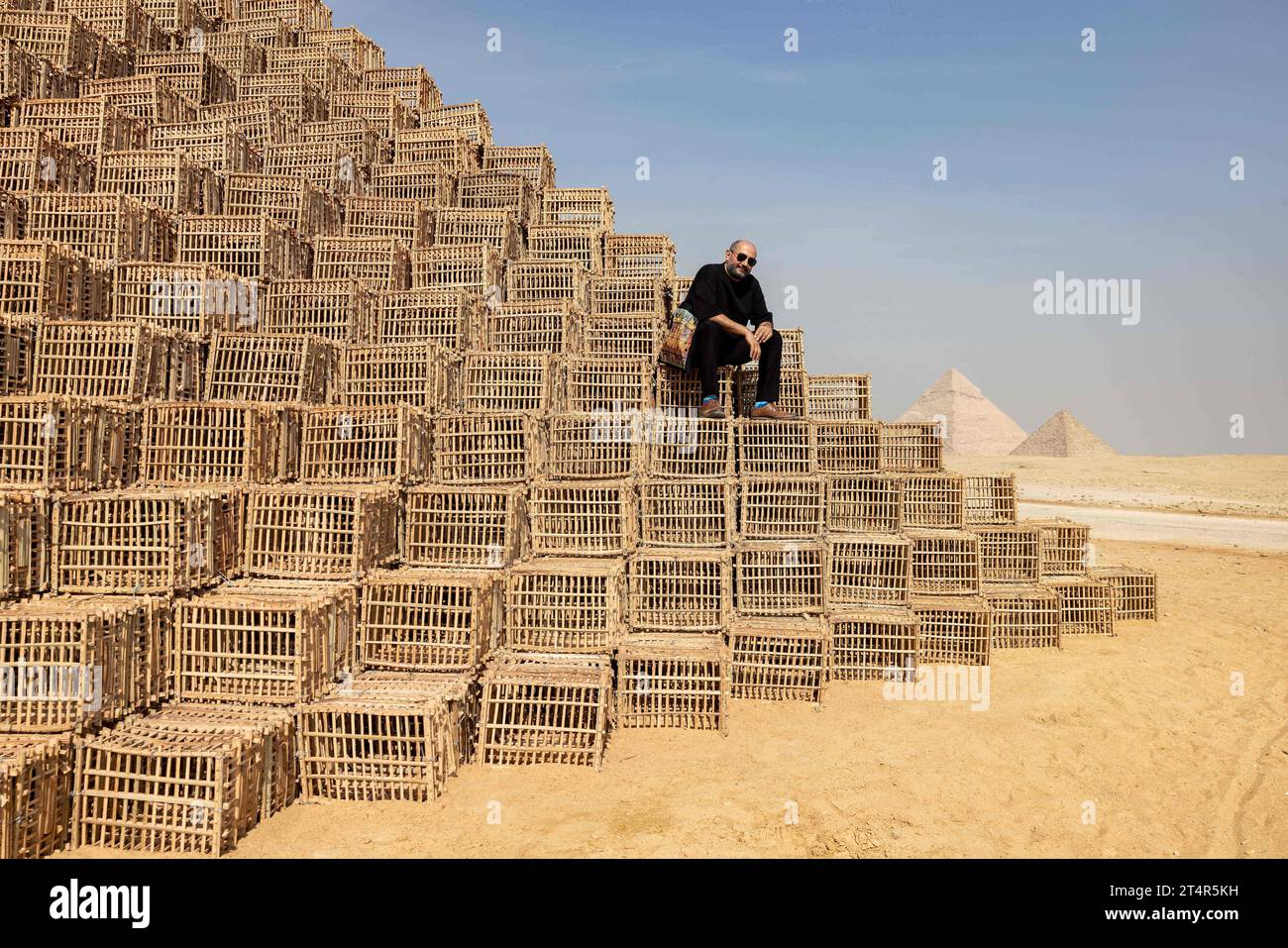 Cairo, Egypt. 26th Oct, 2023. Saudi artist Rashed Al Shashai poses by his artwork ‘Translucent ...
