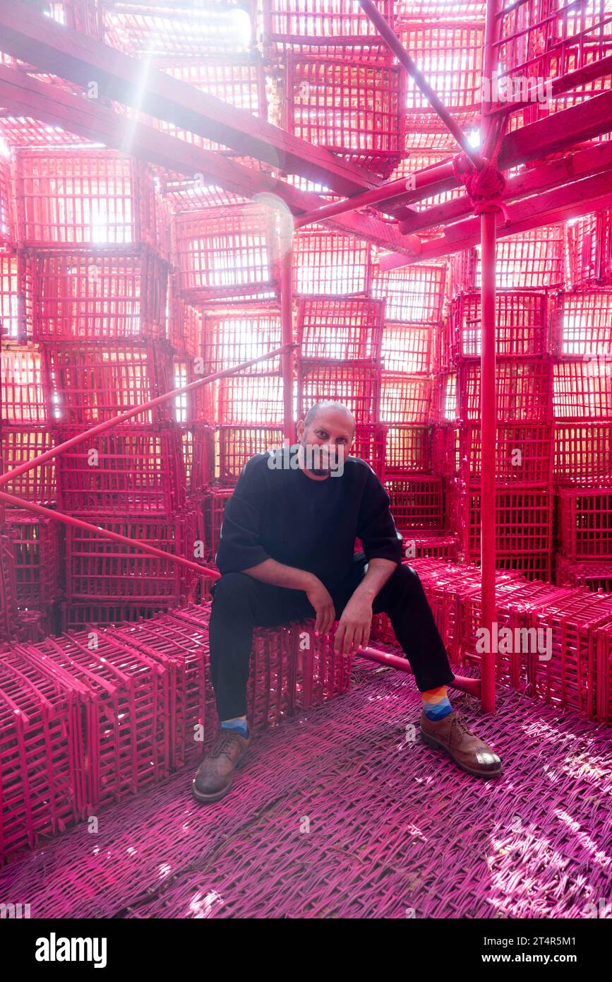 Saudi artist Rashed Al Shashai poses inside his artwork ‘Translucent Pyramid’, as part of 3rd ...