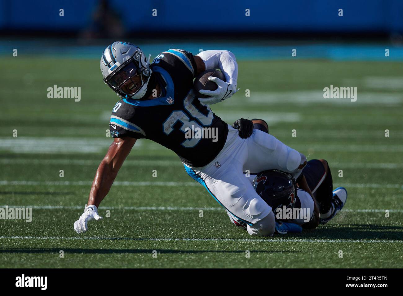 Carolina Panthers running back Chuba Hubbard (30) is tackled by Houston ...