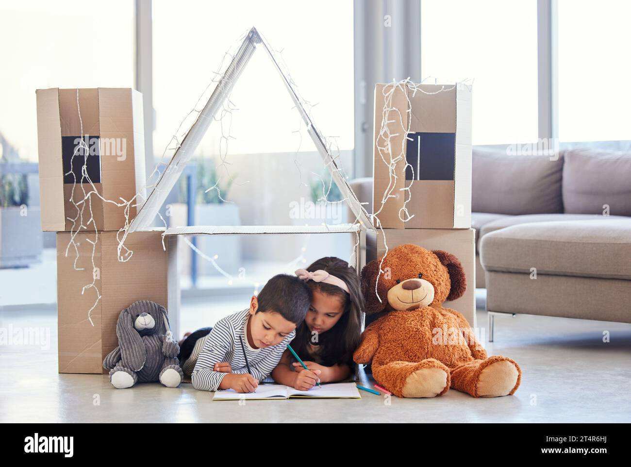 We can draw well. two little siblings drawing together at home Stock ...