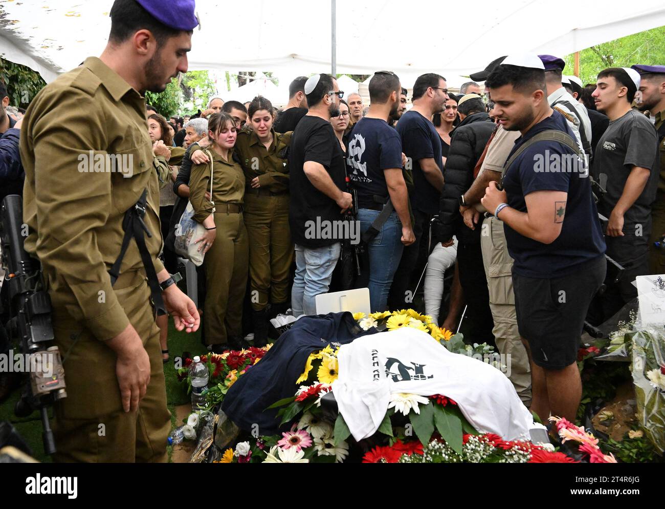 Jerusalem, Israel. 01st Nov, 2023. Friends mourn at the grave of the ...