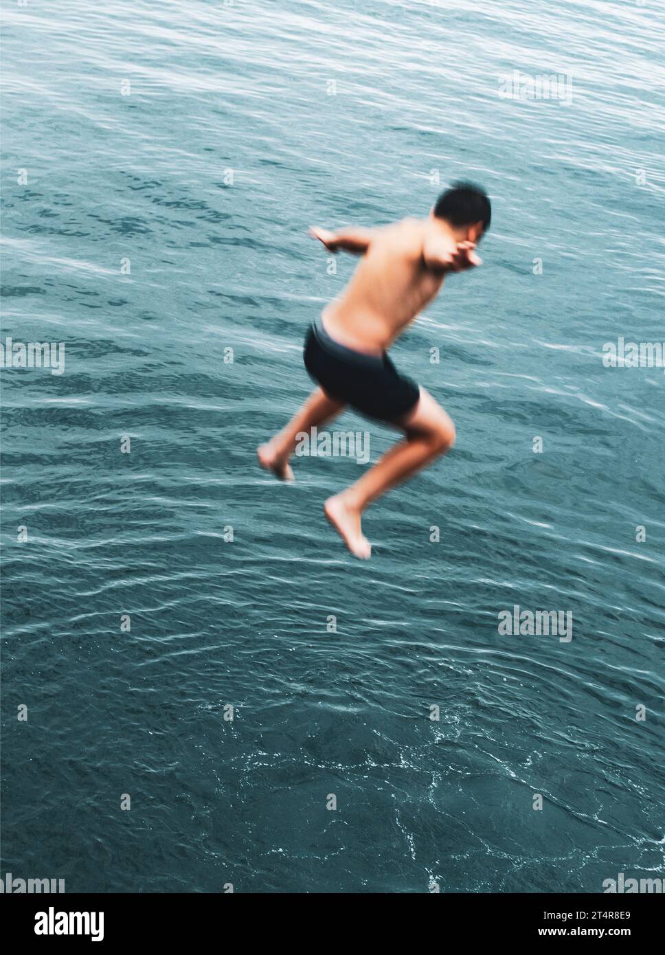 boy have extremal high water jumping Stock Photo - Alamy
