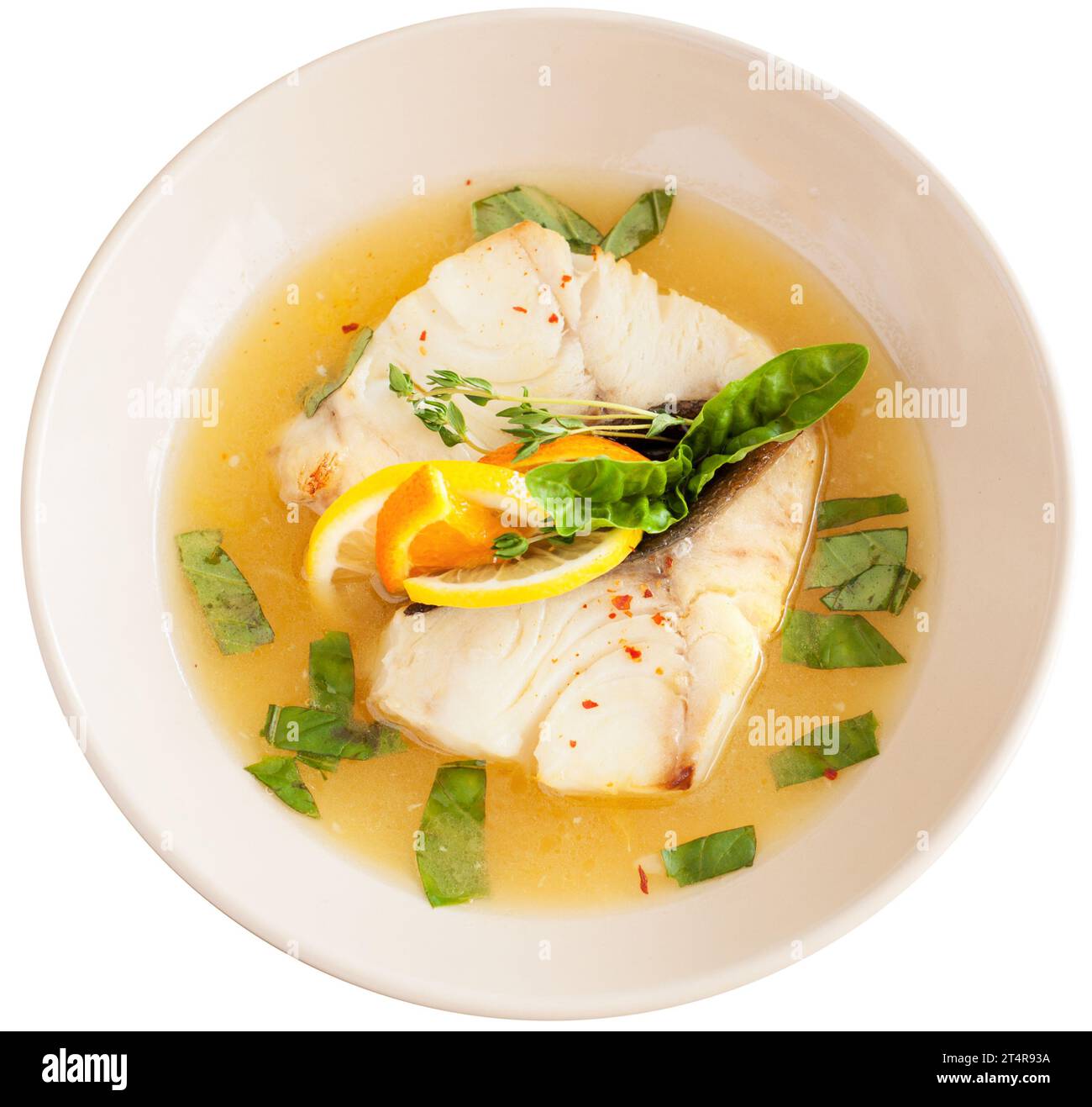 Fried cod with citrus butter sauce in a bowl. Isolated on white ...
