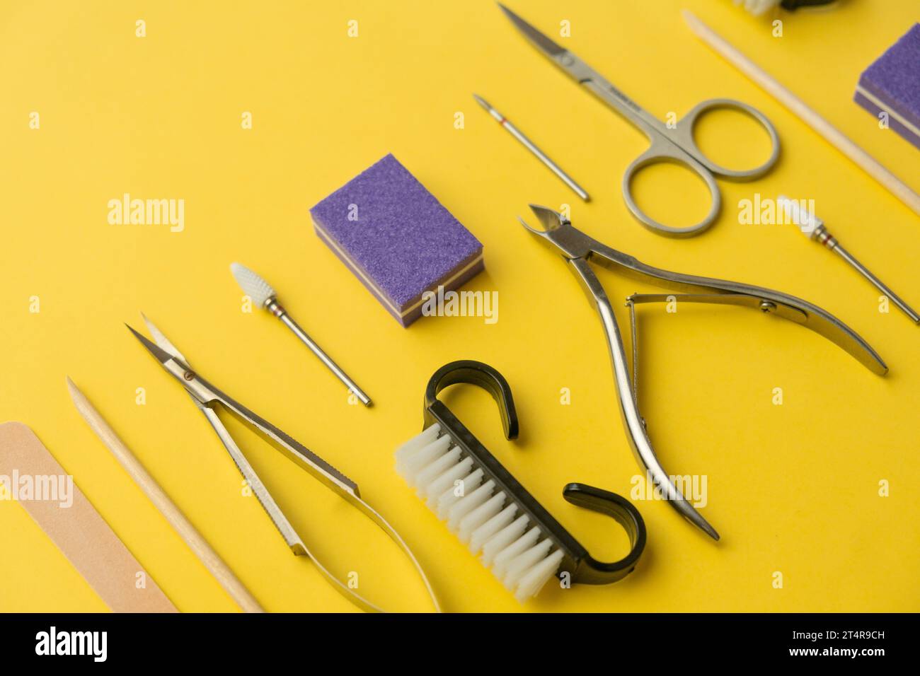 Professional manicure tools on yellow background. Manicure set Stock ...