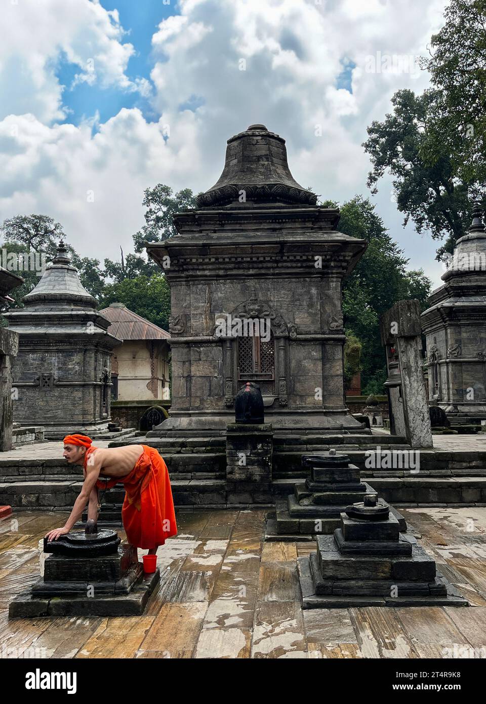 Kathmandu, Nepal:hindu monk cleaning the altars after animal sacrifice ...