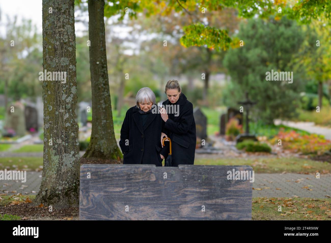 Woman standing grave in cemetery hi-res stock photography and images ...