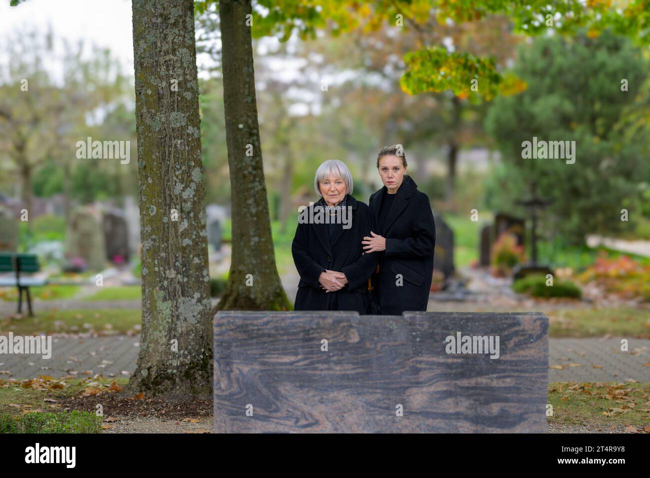 Woman standing grave in cemetery hi-res stock photography and images ...