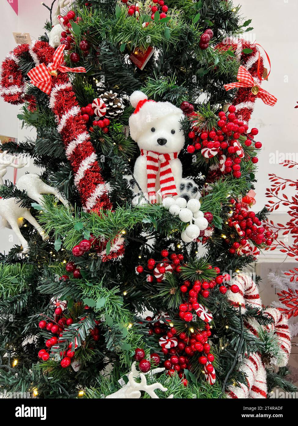 Christmas tree decorated with teddy bear, garlands and toys Stock Photo ...