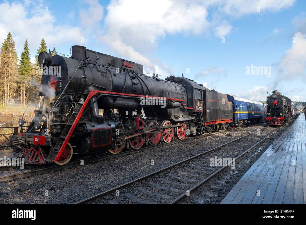 RUSKEALA, RUSSIA - OCTOBER 06, 2023: Two retro trains "Ruskeala Express ...