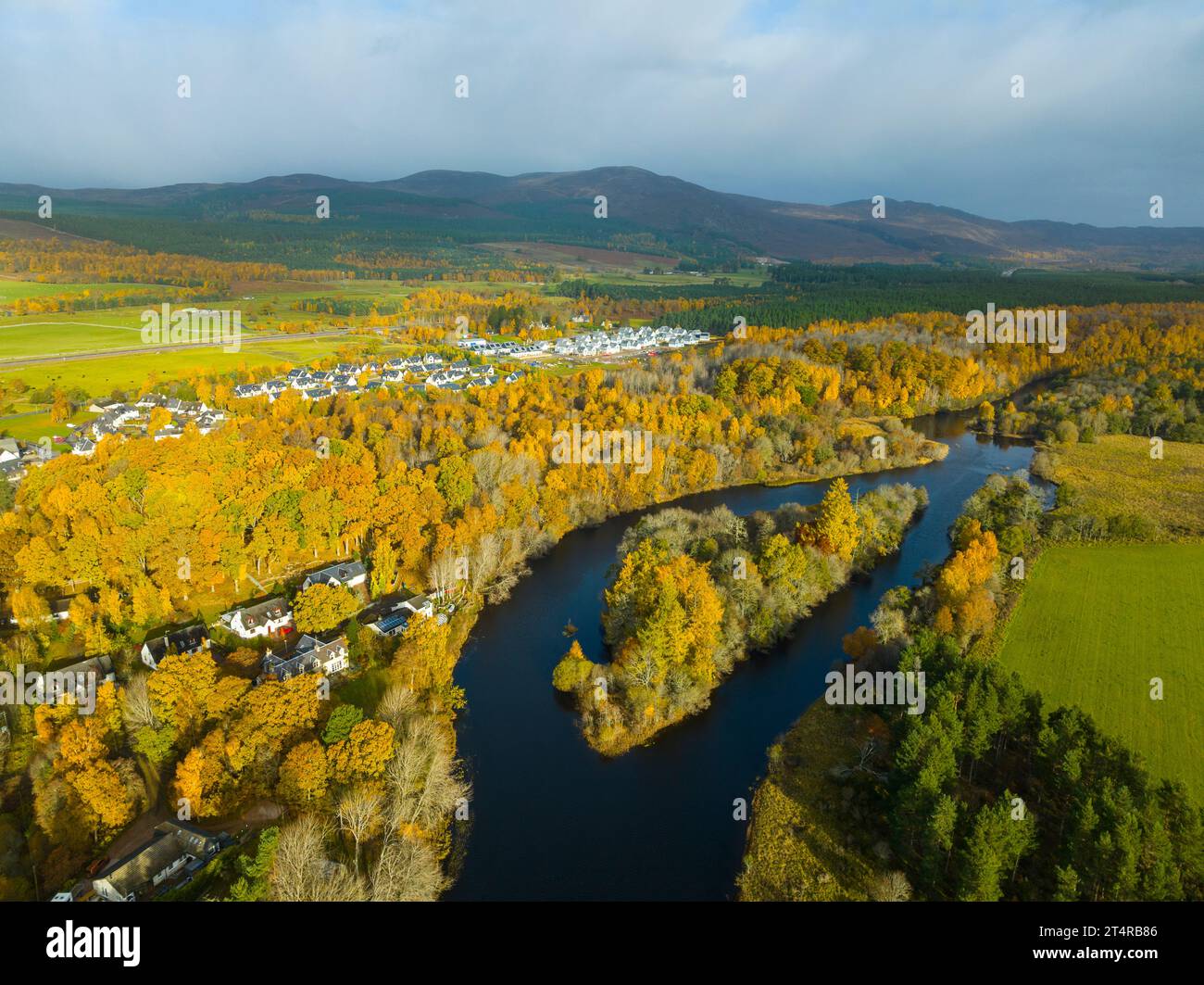 Aerial view of River Spey and autumn colours in woodland at , Kincraig ...