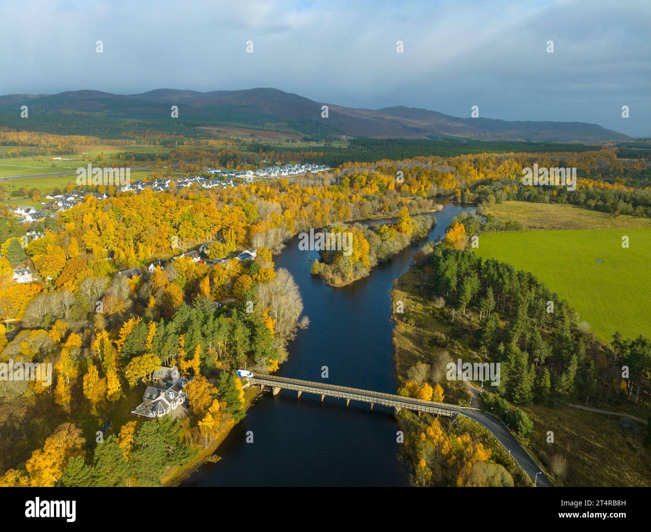 Aerial view of River Spey and autumn colours in woodland at , Kincraig ...