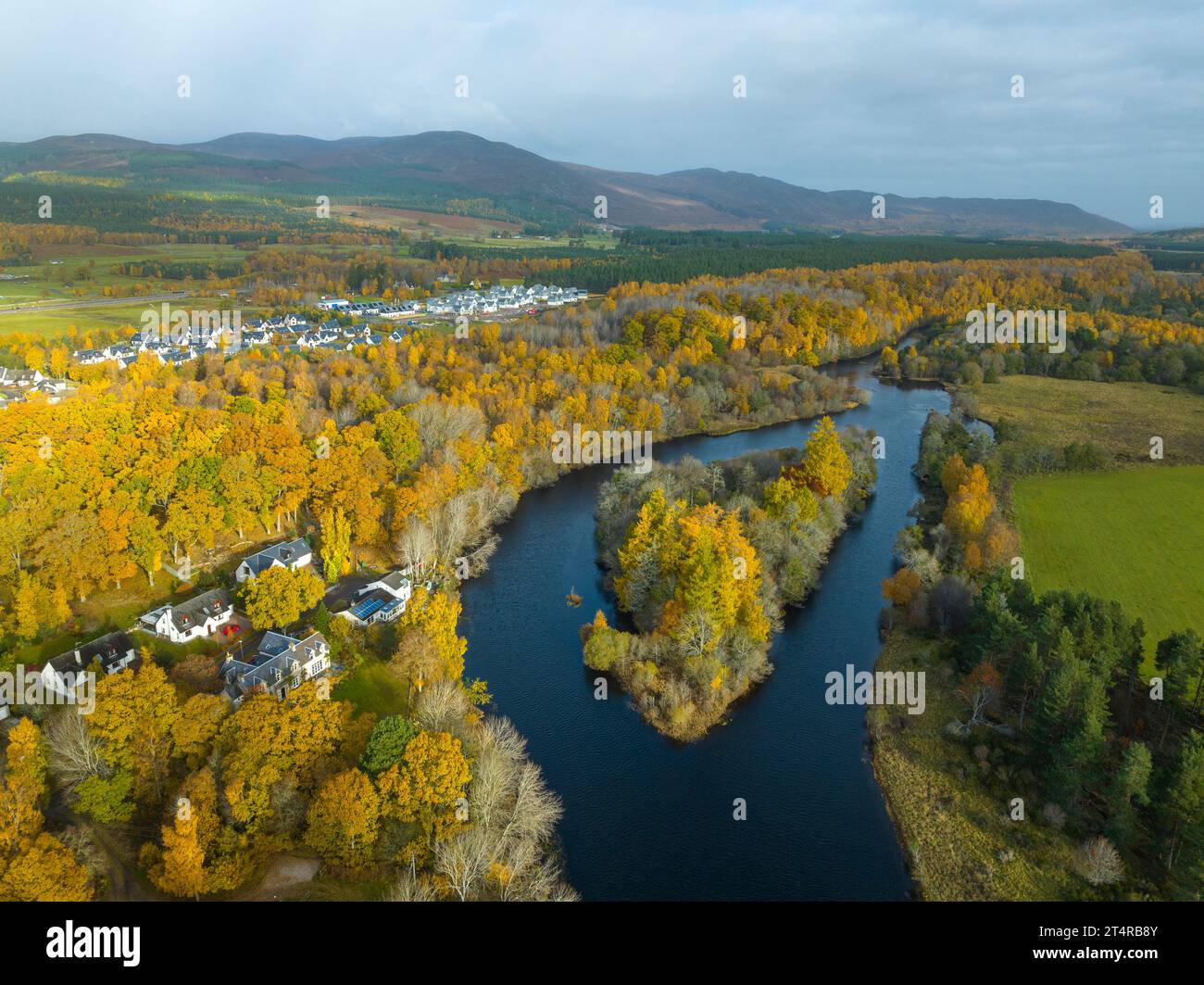 Aerial view of River Spey and autumn colours in woodland at , Kincraig ...