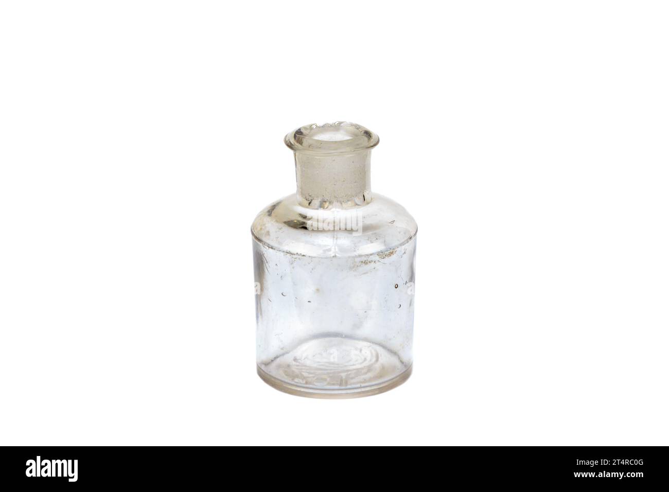 Small Vintage Victorian clear glass ink bottle isolated with a white ...