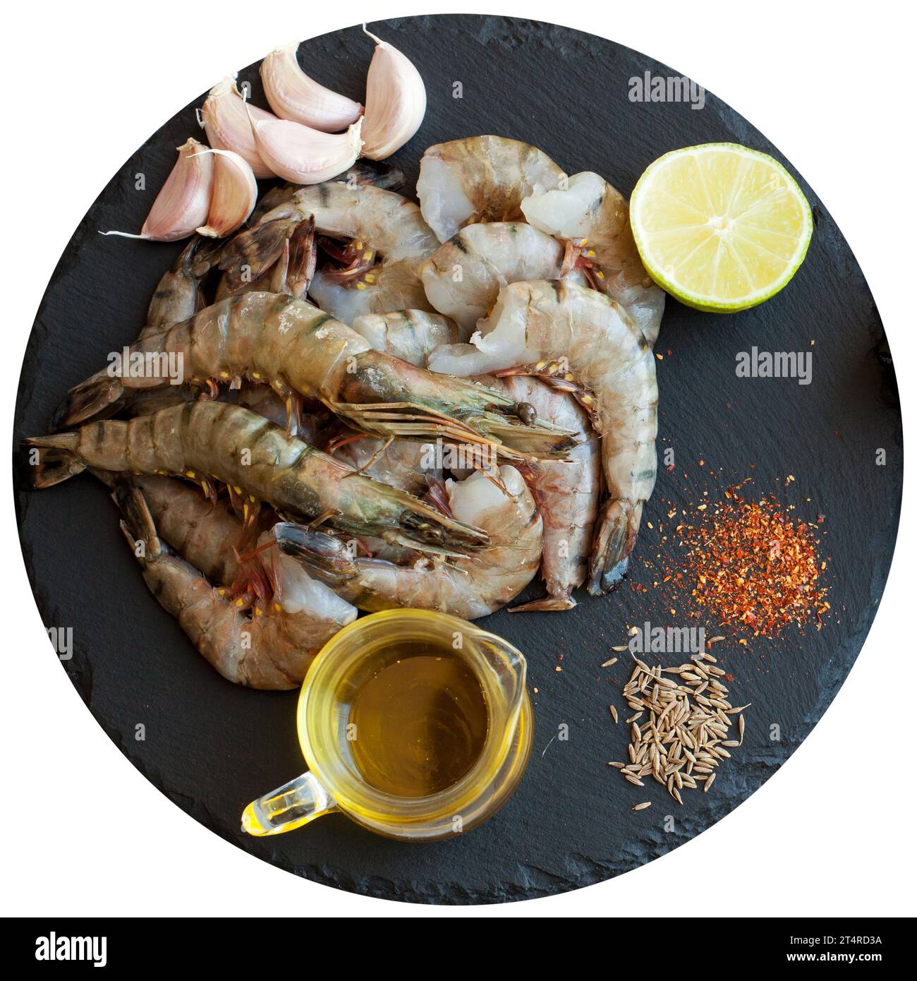 Raw ingredients for seafood dish - tiger shrimps, olive oil, garlic and ...