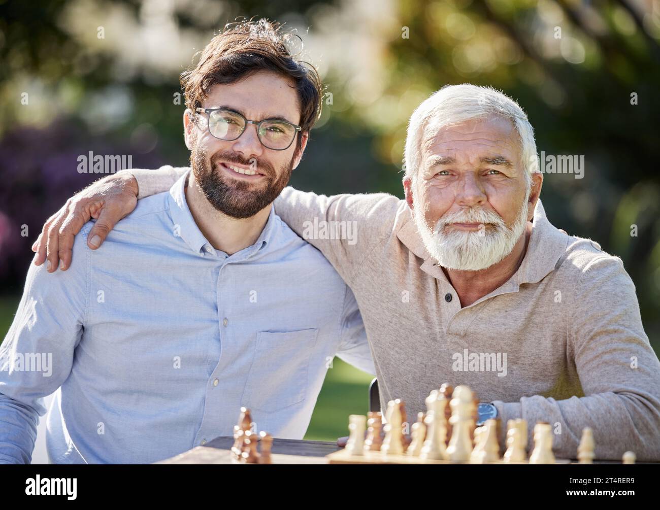 Every chess champion was once a beginner. a young and senior man ...