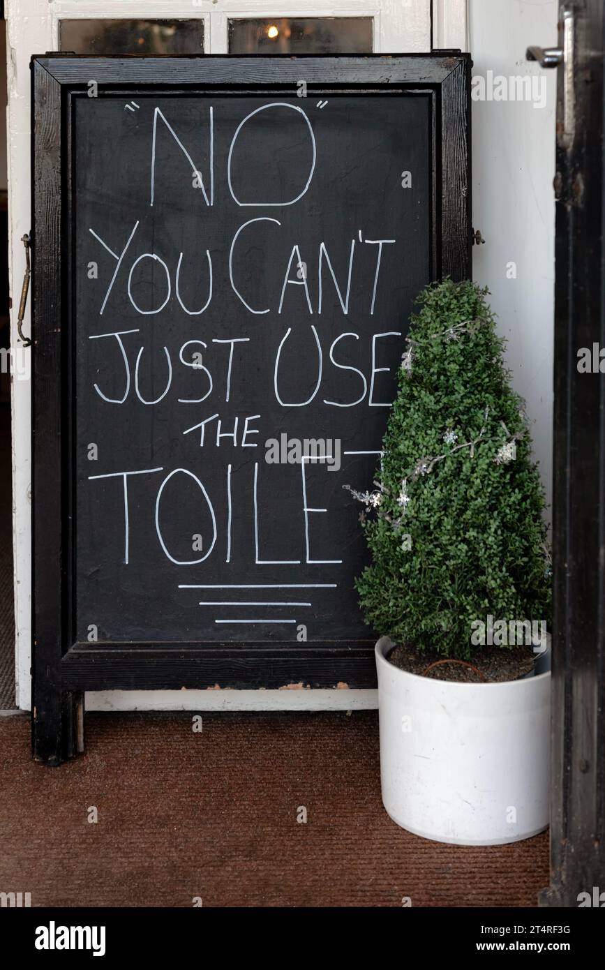 Sign at pub entrance Stock Photo - Alamy