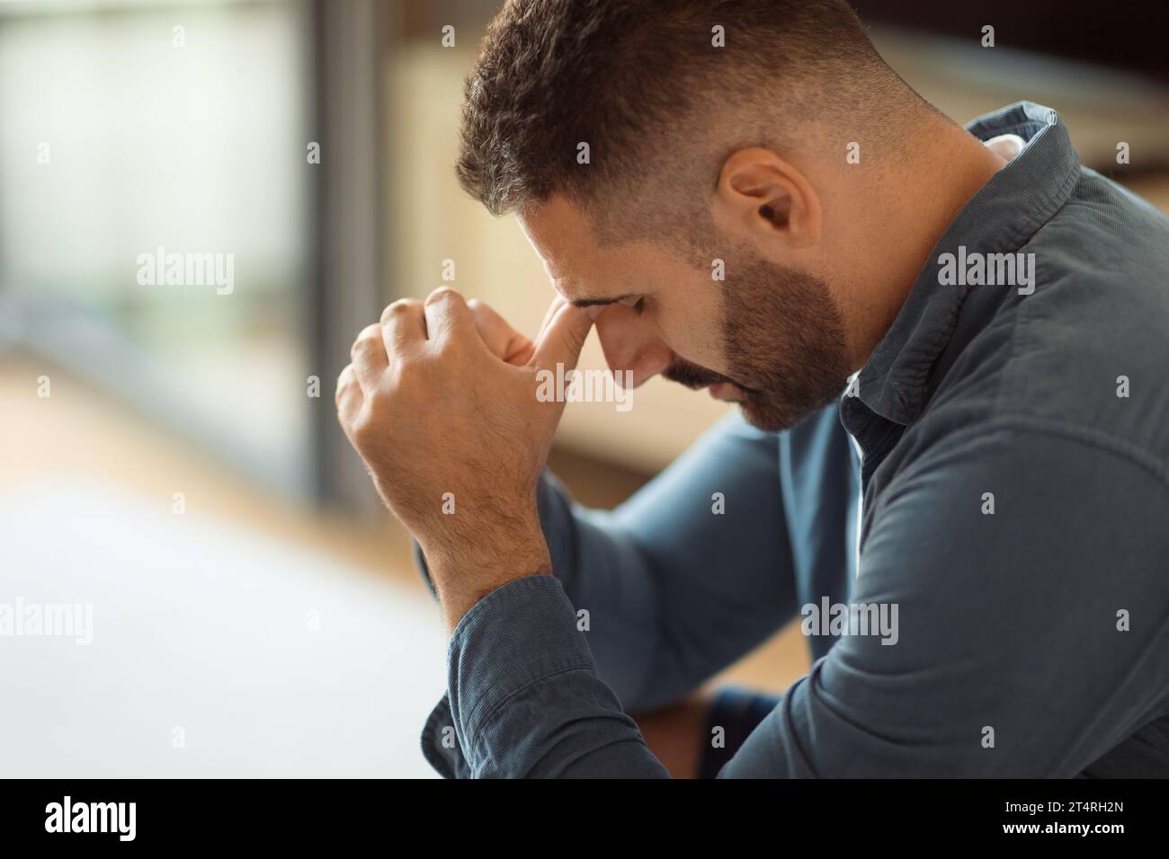 Stressed middle aged man suffering from unhappiness alone at home Stock ...