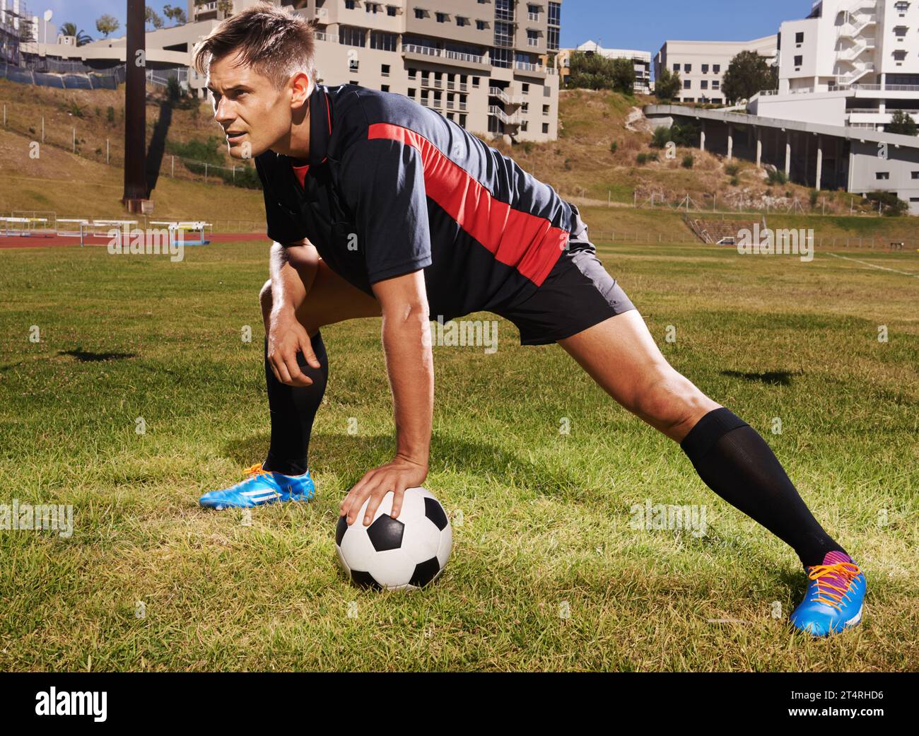 Footballer with ball up his shirt hi-res stock photography and images ...