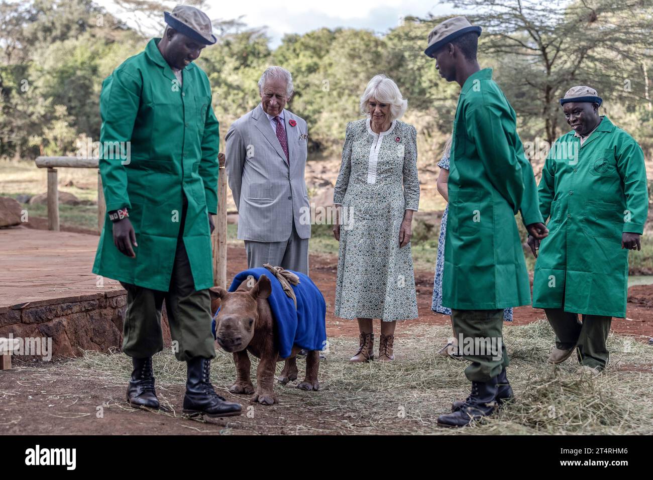 Britain's King Charles III and Britain's Queen Camilla look at a baby ...