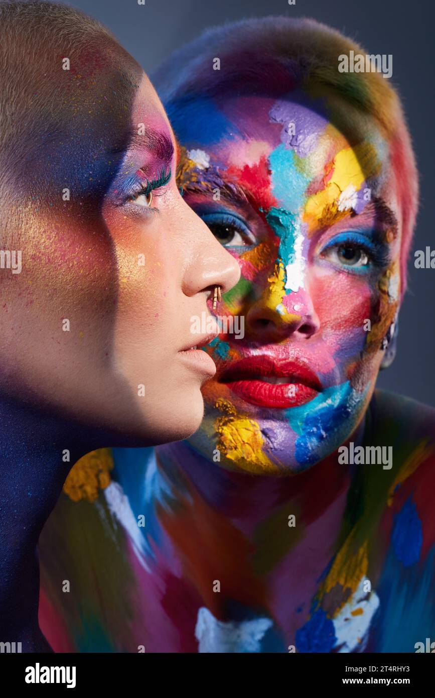 Everyone needs a little colour in their life. Studio shot of two young ...