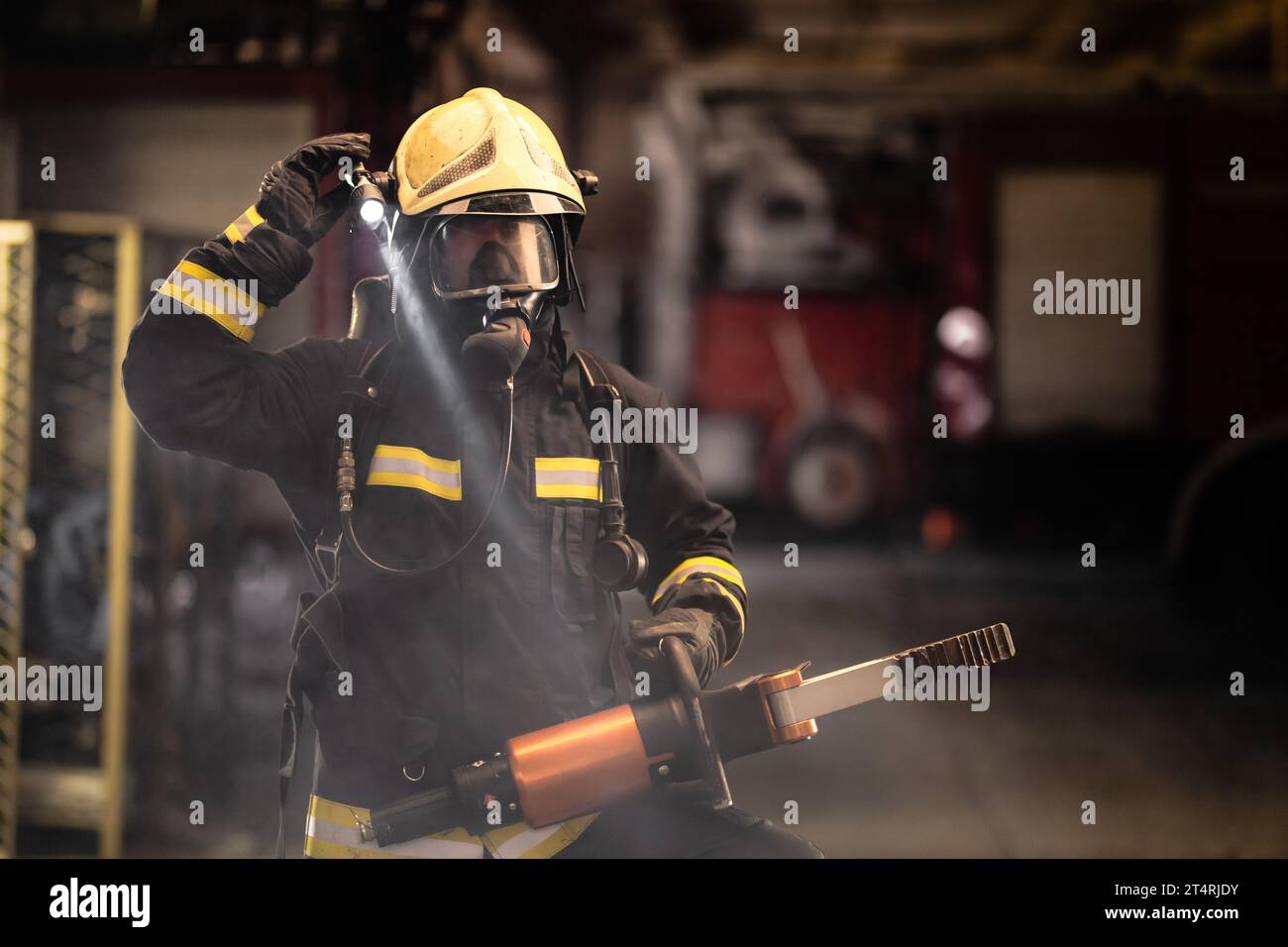 Fireman portrait wearing full equipment and oxygen mask. Firefighter ...