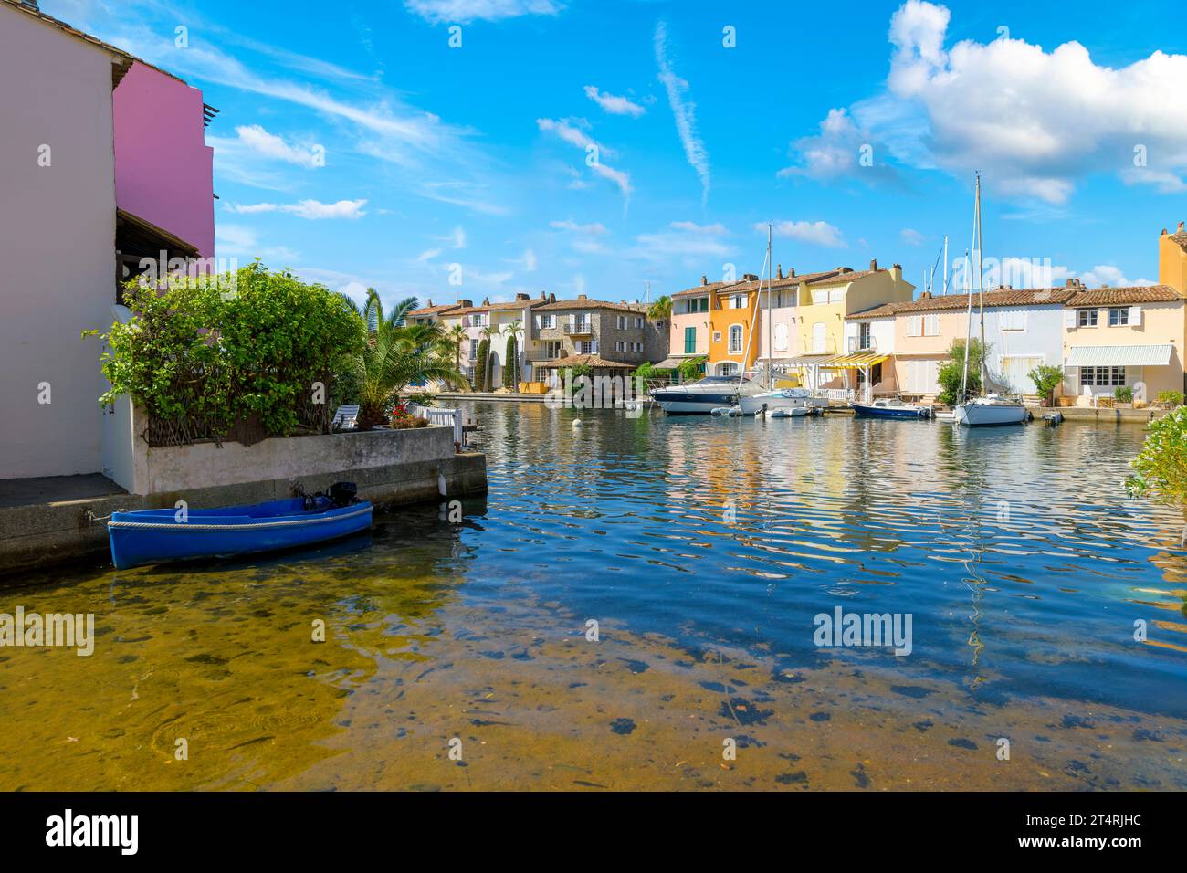 Colorful waterfront homes with boat docks in the planned luxury ...