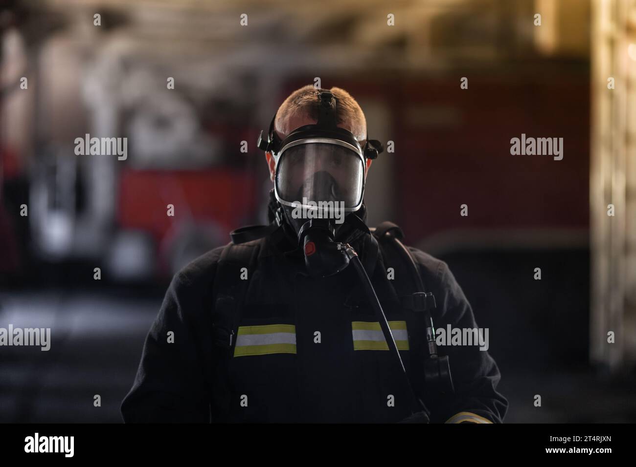 Firefighter wearing full equipment and emergency rescue equipment wiht ...