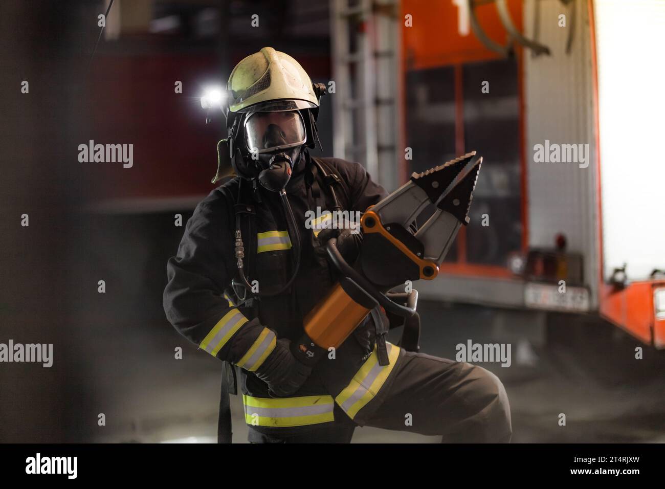 Fireman portrait wearing full equipment and oxygen mask. Firefighter ...