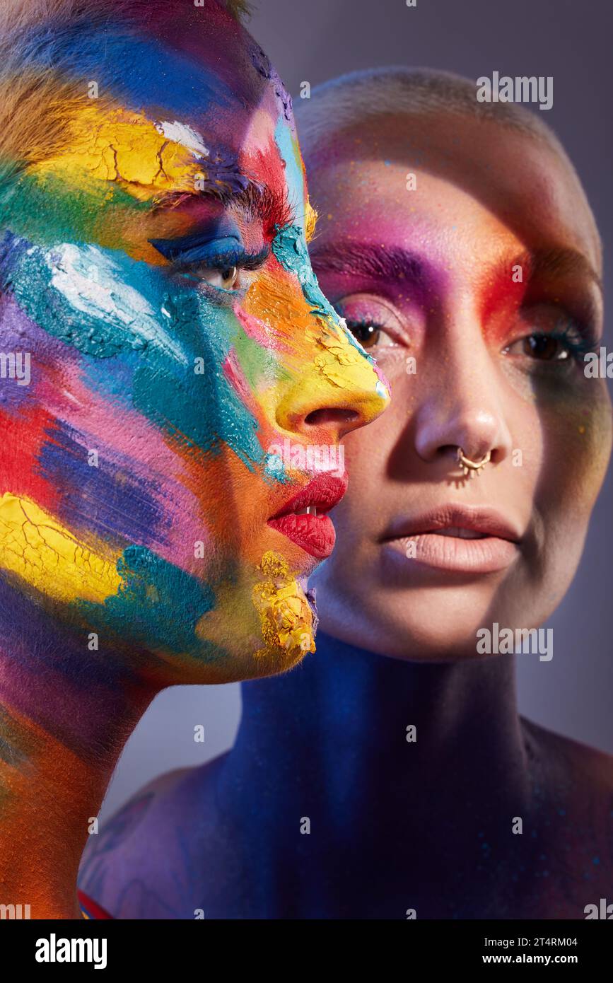 Feeling bright. Studio shot of two young women posing with multi ...