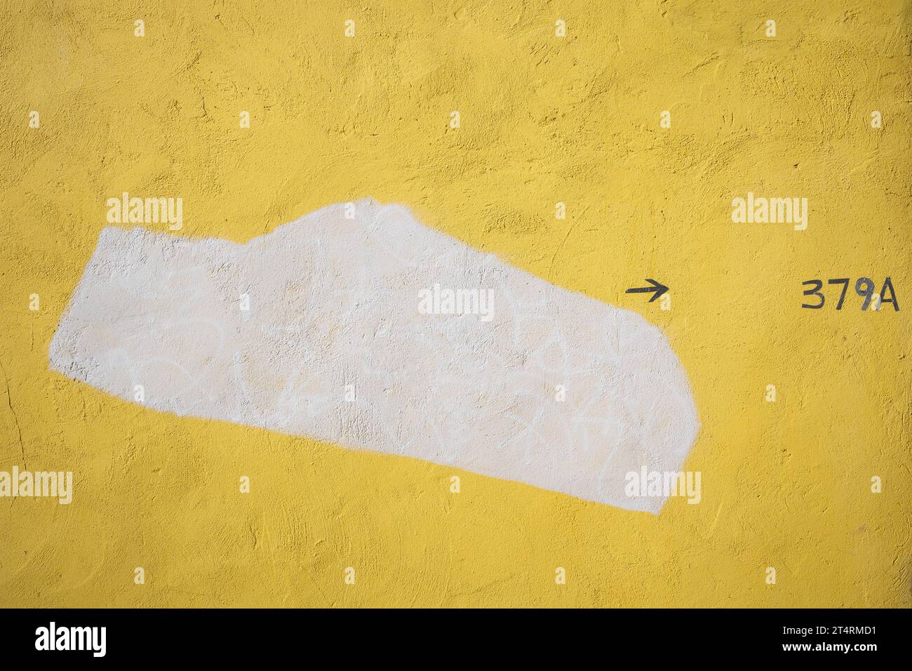 A flat number is on a yellow-painted wall in East Dulwich in the London ...