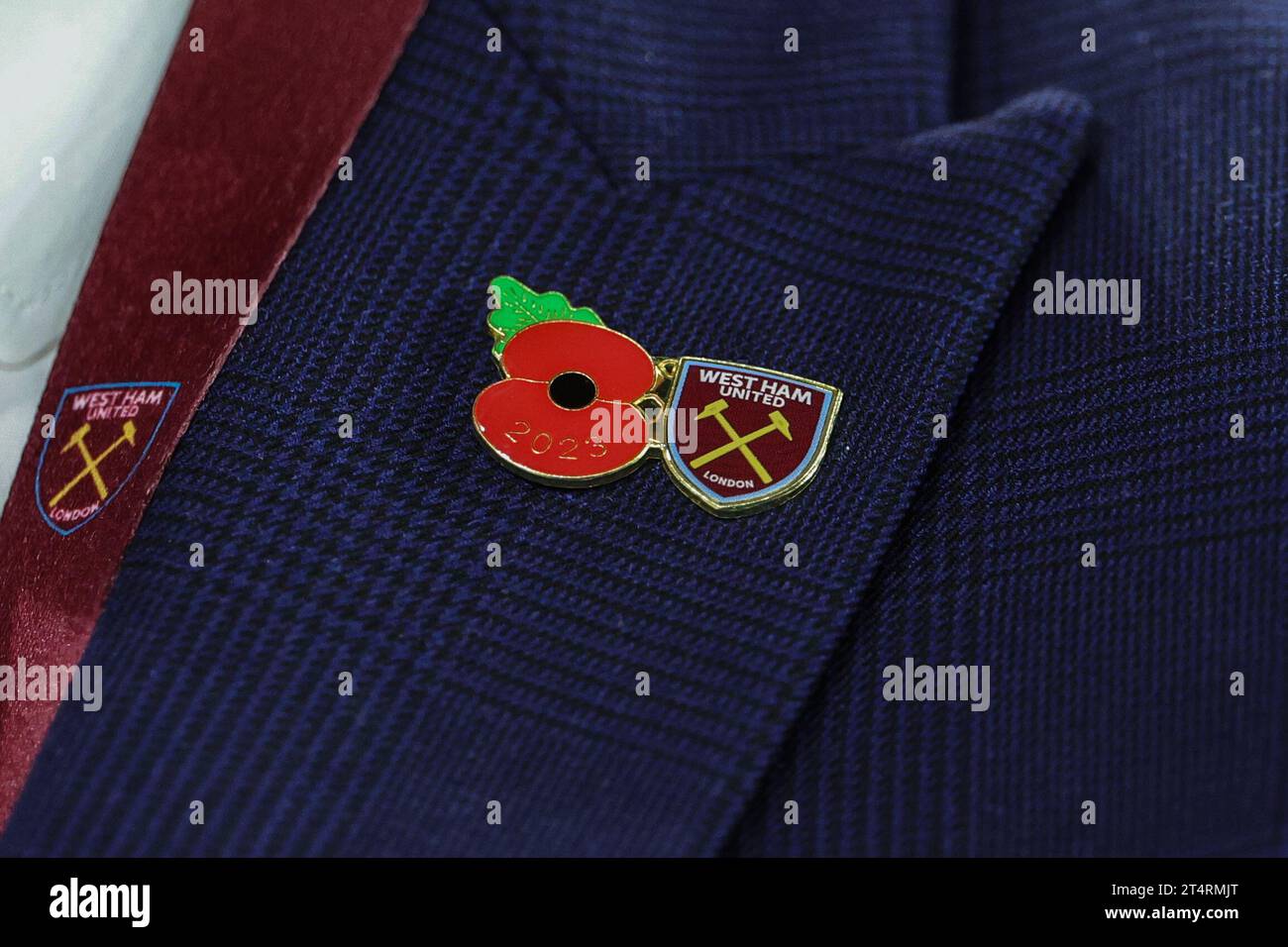 London, UK. 01st Nov, 2023. A Remembrance Poppy and West Ham United pin ...