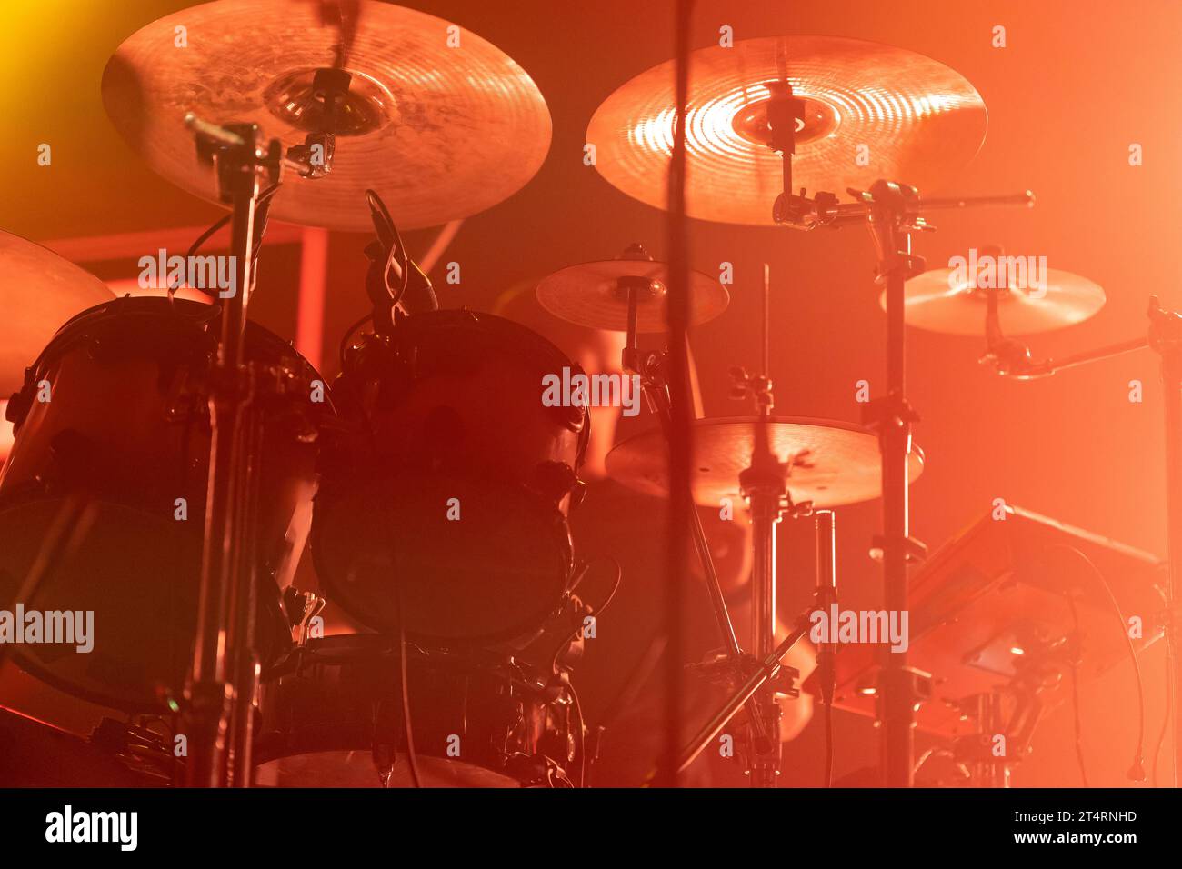 A close-up of a drum set in colorful lighting Stock Photo - Alamy