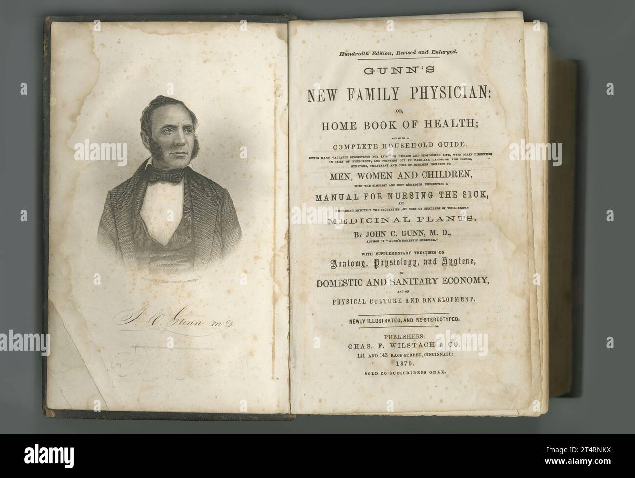 Old and weathered textbook. An aged book with its pages on display ...