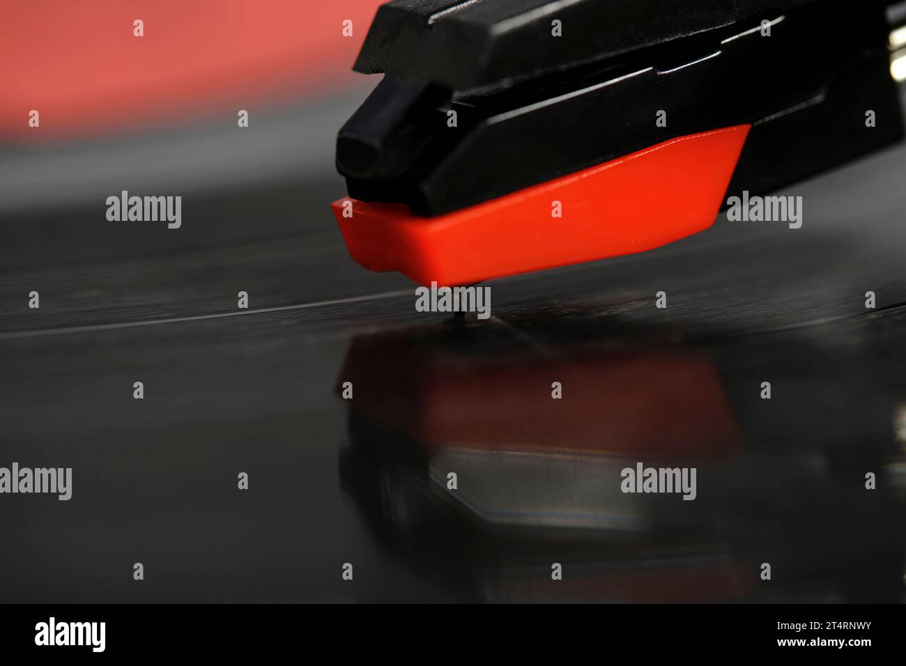 Needle of vinyl player is mounted on record. Closeup on macro photos ...